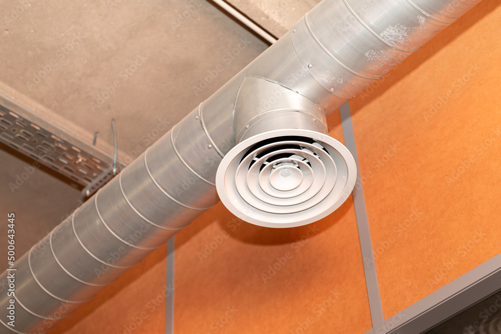 Industrial ventilation system on a concrete ceiling in an industrial ...