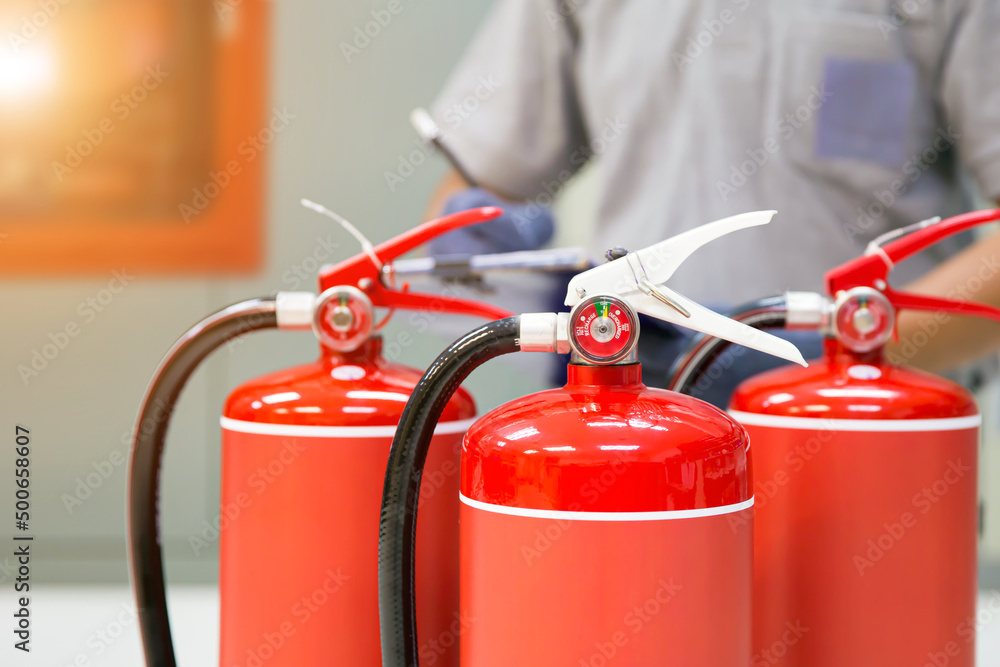 Fire extinguisher has hand engineer inspection checking pressure gauges ...