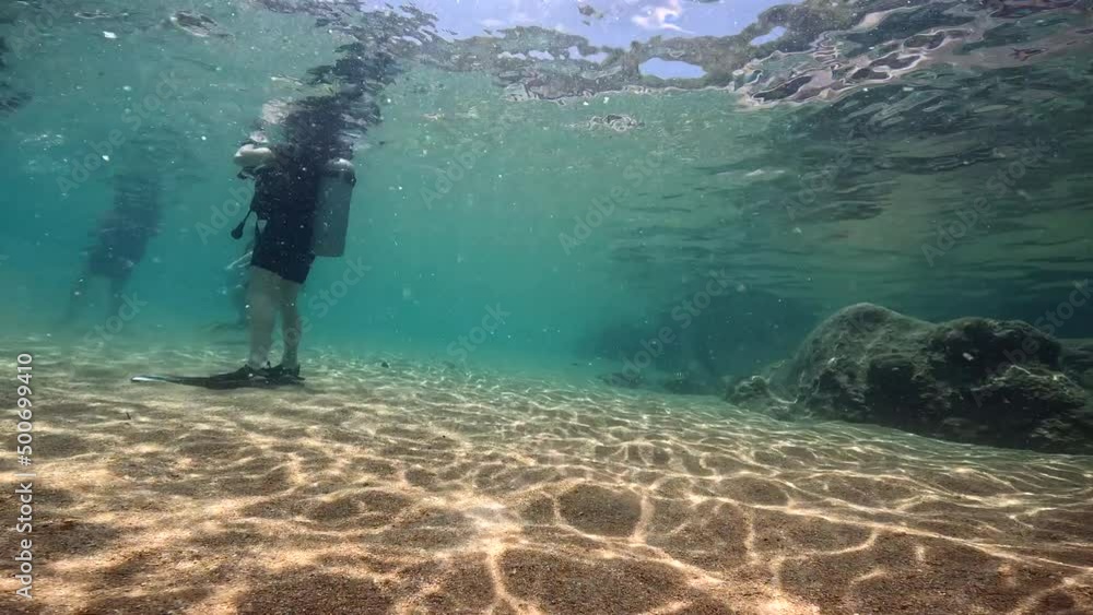 Under Water Film 4k - Thailand - 1 meter deep water - divers standing ...