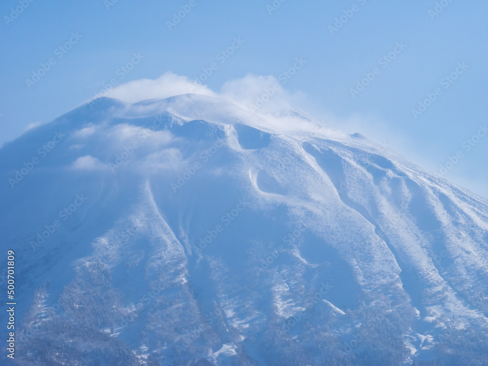 Snow blown up by wind on the top of snowy volcano (Niseko, Hokkaido ...