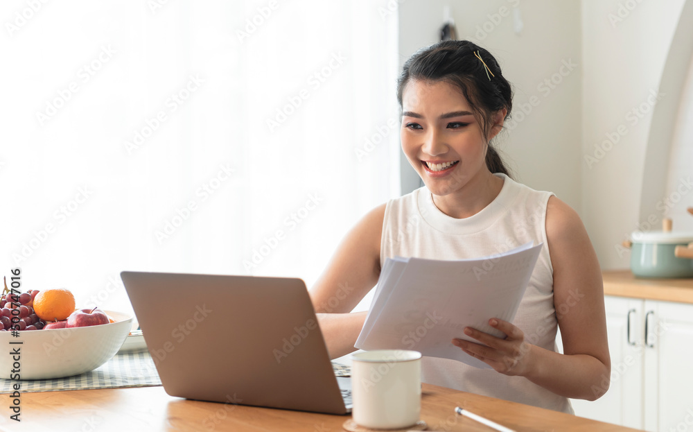 young Asian businesswoman using computer laptop talking for video call ...
