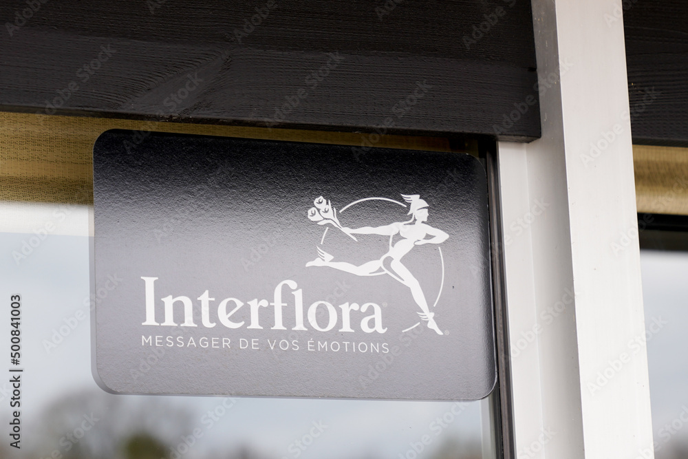 Interflora logo text and brand sign store front windows facade of ...
