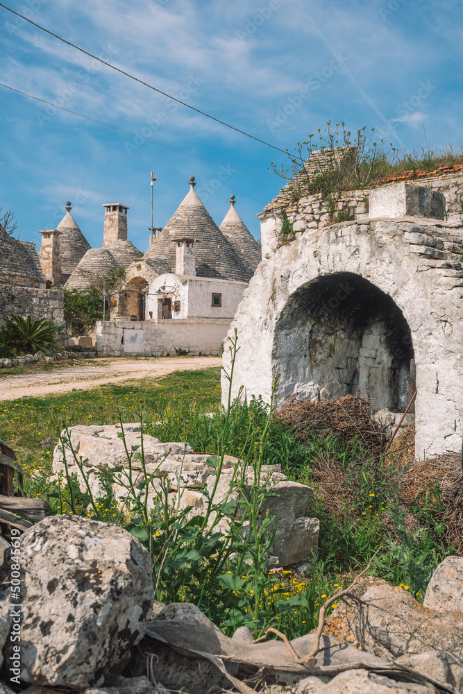 Group of beautiful Trulli or Trullo house, traditional Apulian dry ...
