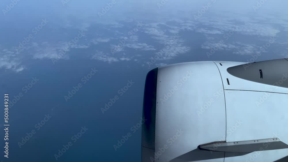 Clouds and sky as seen through window of an aircraft. Looking through ...