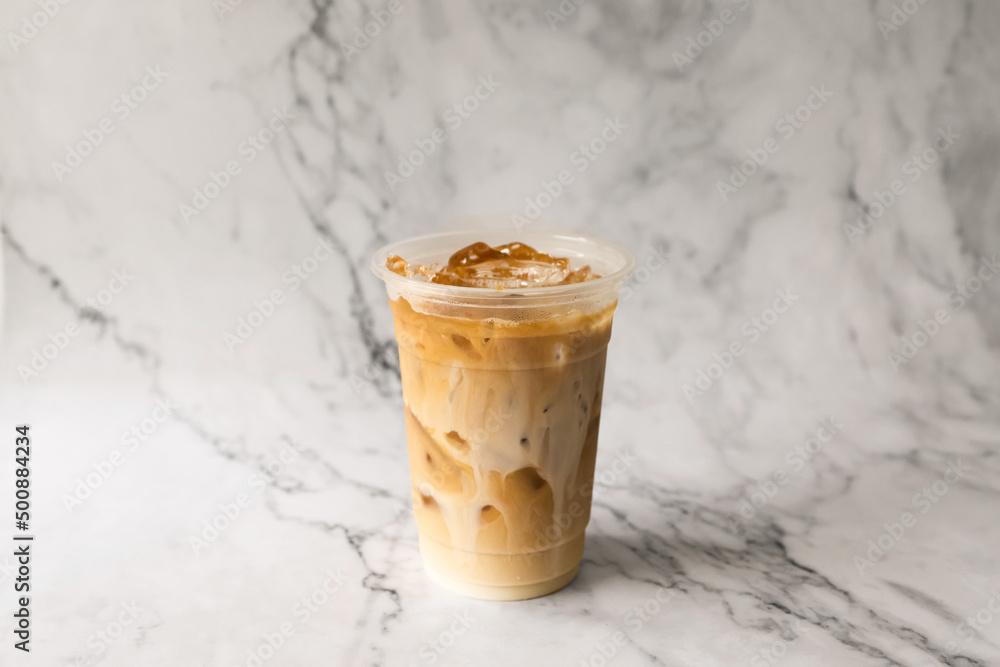 Iced latte coffee on plastic cup place marble background Stock Photo ...
