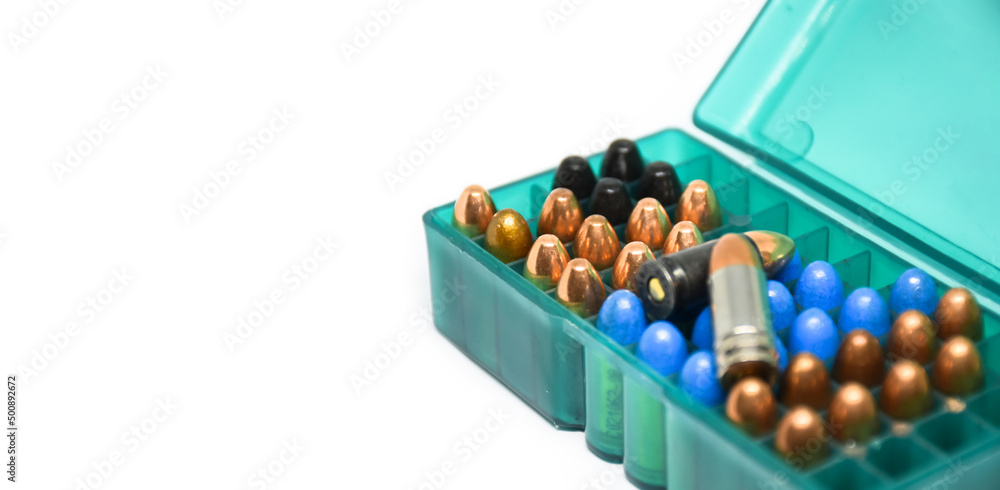 9MM pistol bullets in plastic box on white background, concept for ...