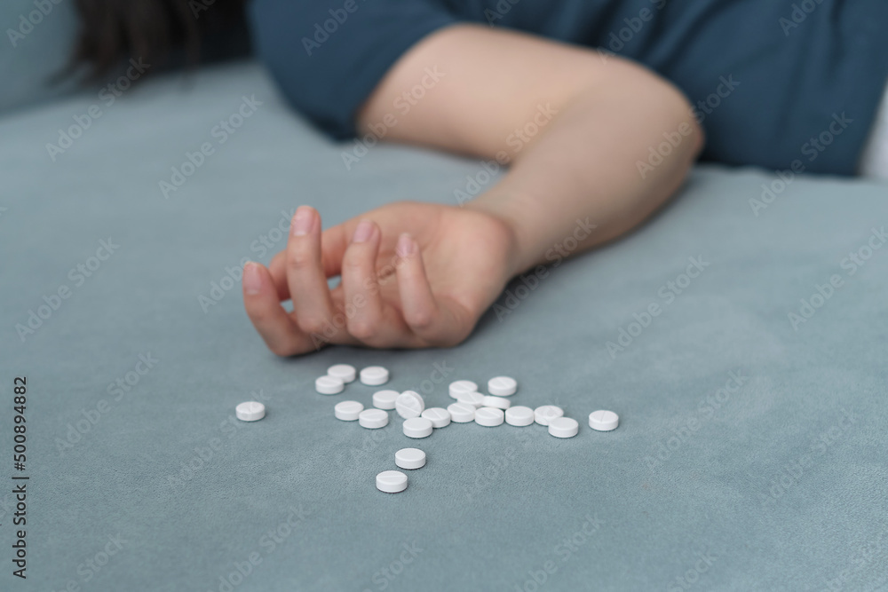 Overdose pills and addict concept background. woman sleep unconscious ...