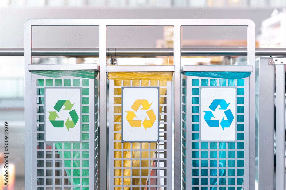 Color waste sorting bins indoors. Recycling concept Stock Photo | Adobe ...