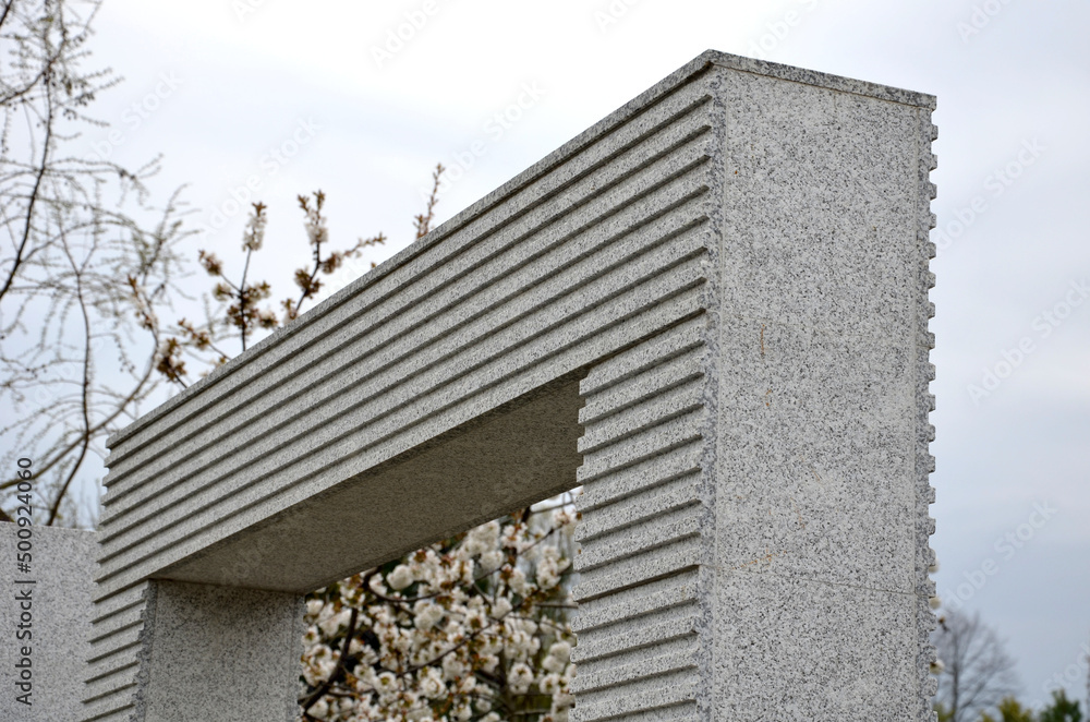 gate with stone cladding of stone granite slabs with striped ridges ...