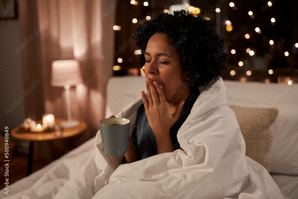 people, bedtime and rest concept - tired sleepy woman in pajamas ...