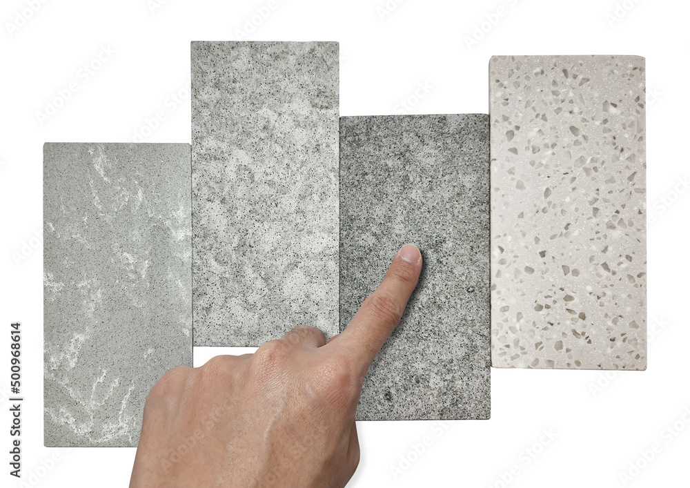 designer's hand picking premium set of artificial stone samples ...