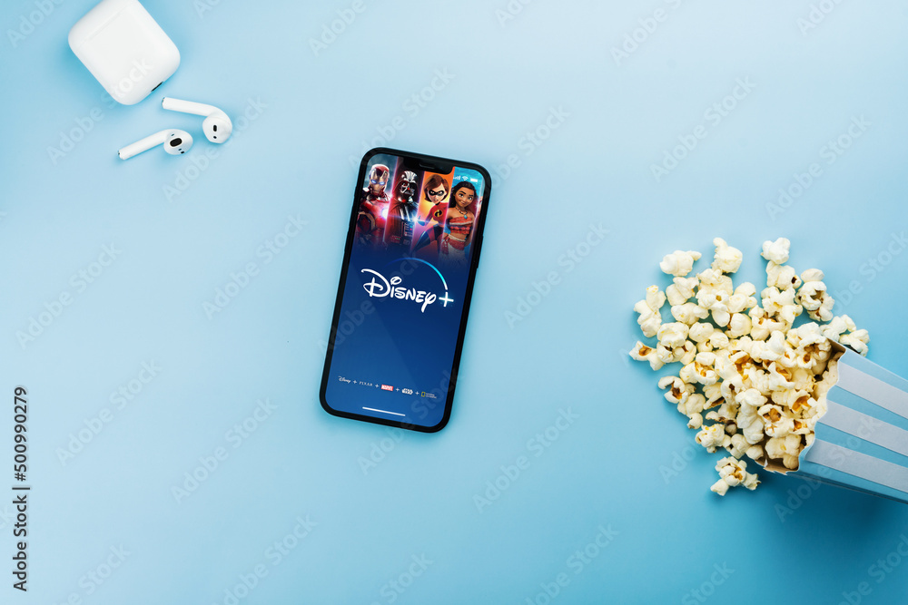 Disney+ (Disney Plus) streaming app on smartphone screen. Blue ...