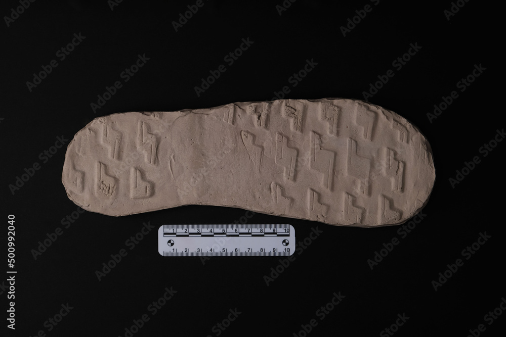 plaster cast of a shoe sole from a crime scene Stock Photo | Adobe Stock