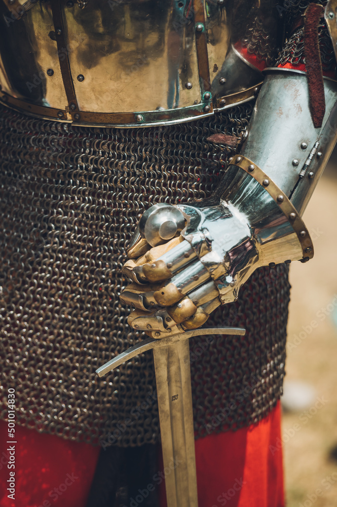 Pitch battle of medieval knights, using metal armor, axes, swords and ...