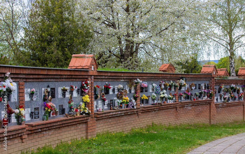 the wall where the urns of the cremated people are buried in the ...