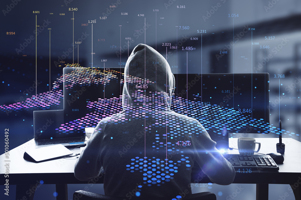 Back view of hacker using computers at desktop with abstract digital ...