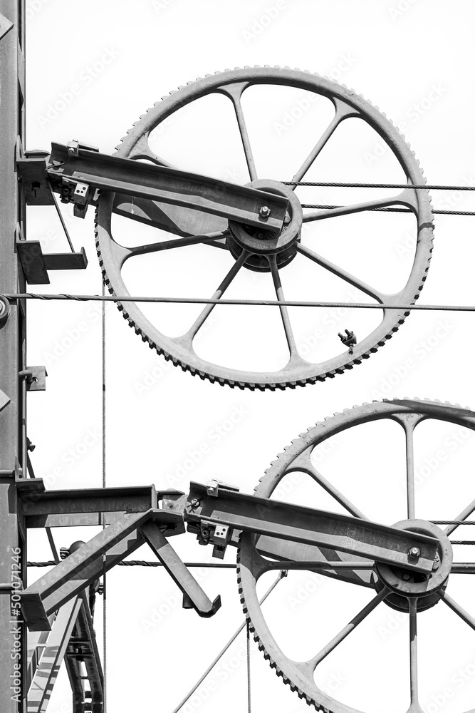 Detail of the pulley of the catenary of a railway line. Isolated white ...