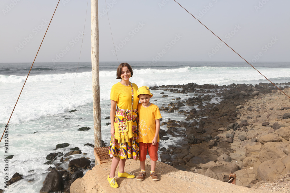 Tourist people, mother with son, woman and kid, child. Atlantic ocean ...
