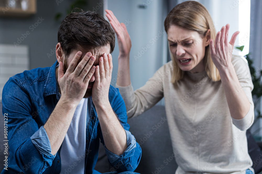 Family quarrel, woman quarrels and yells at the loser's husband, couple ...