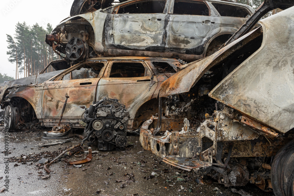 Many shot and destroyed cars of civilians at the car graveyard in Irpin ...