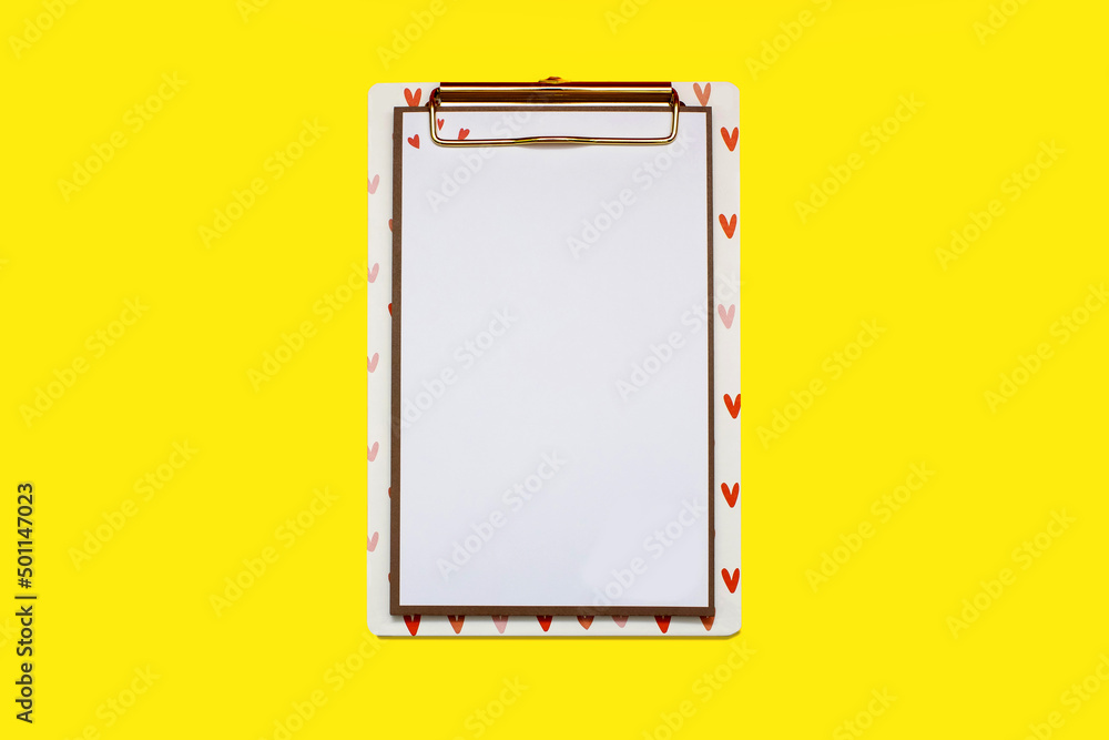 Not a standard notebook with a clip-on white paper holder on a yellow ...