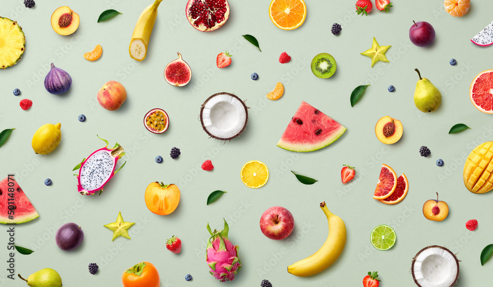 Colorful pattern of various fresh whole and sliced ripe fruits and ...