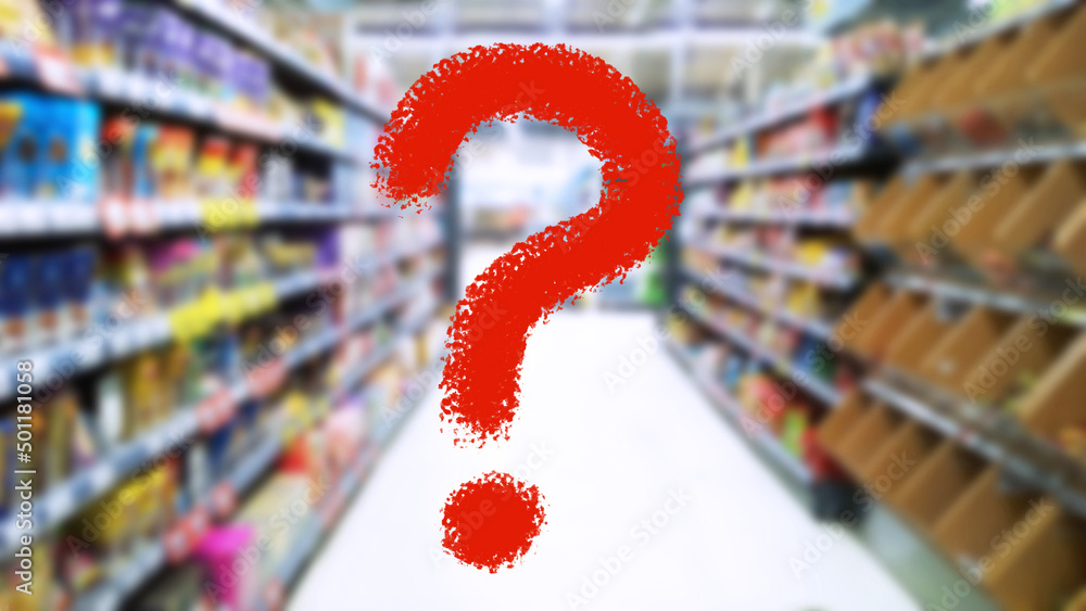 Large red question mark on blur supermarket background. Defocused ...