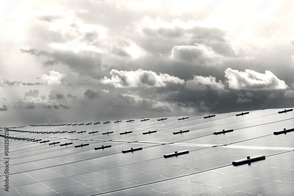 Solar panels farm under the sky. Blue solar panels. Background of photovoltaic modules for ...