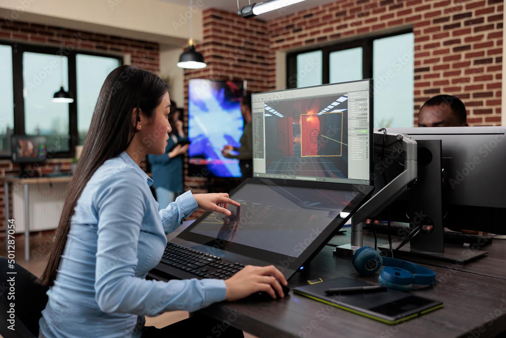 Creative company game developer sitting in production department while ...