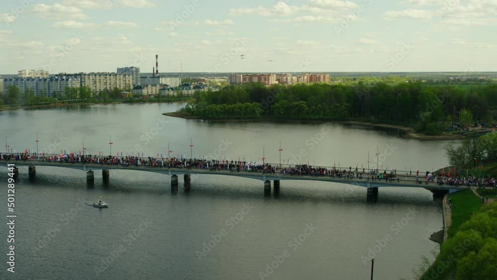 Stockvideon Group of three propeller planes fly over the bridge with ...