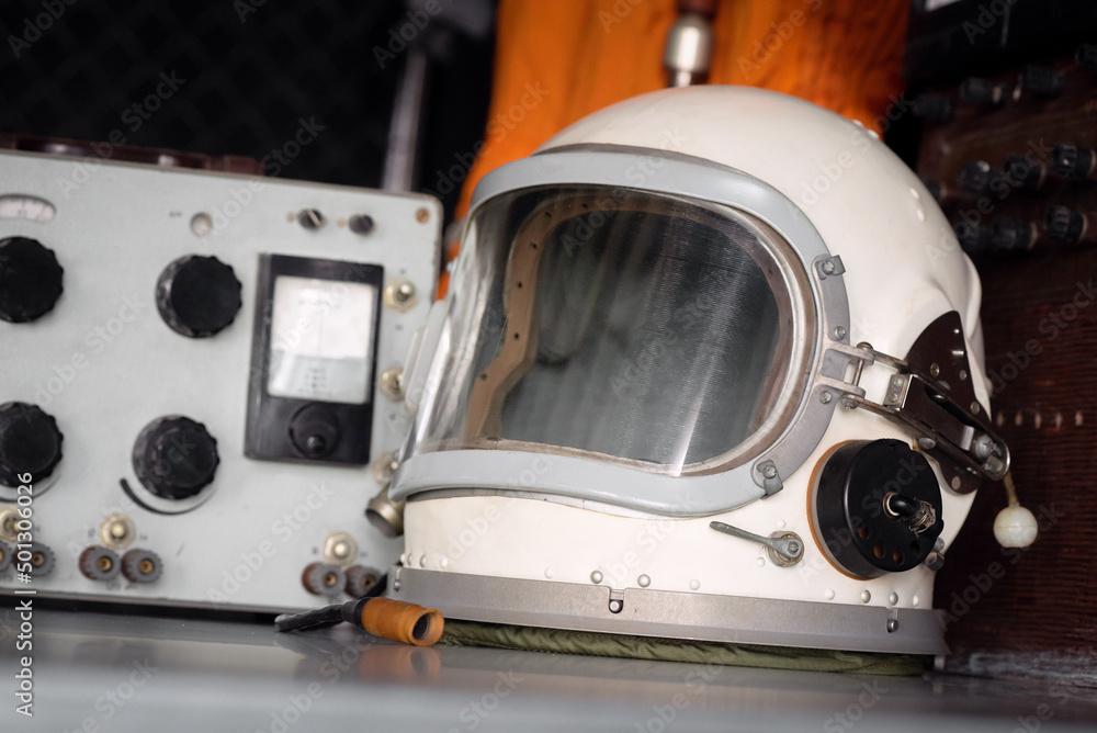 Concept of astronaut helmet on the table of the orbital station ...