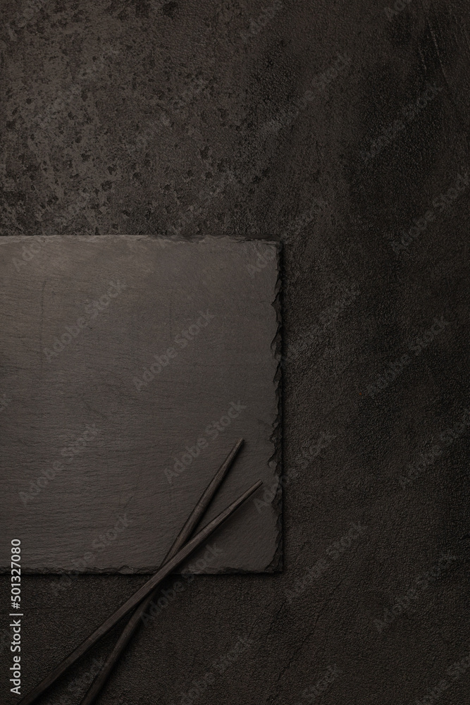 Black slate board on black background with chopsticks Stock Photo ...