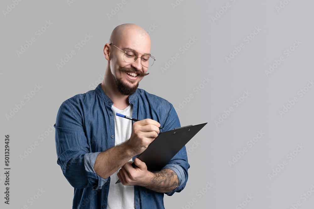 Image of handsome balded with musctache and beard happy man wearing ...