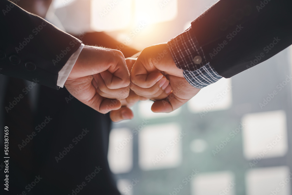 Team business people fist bump at meeting. Unity and teamwork concept ...