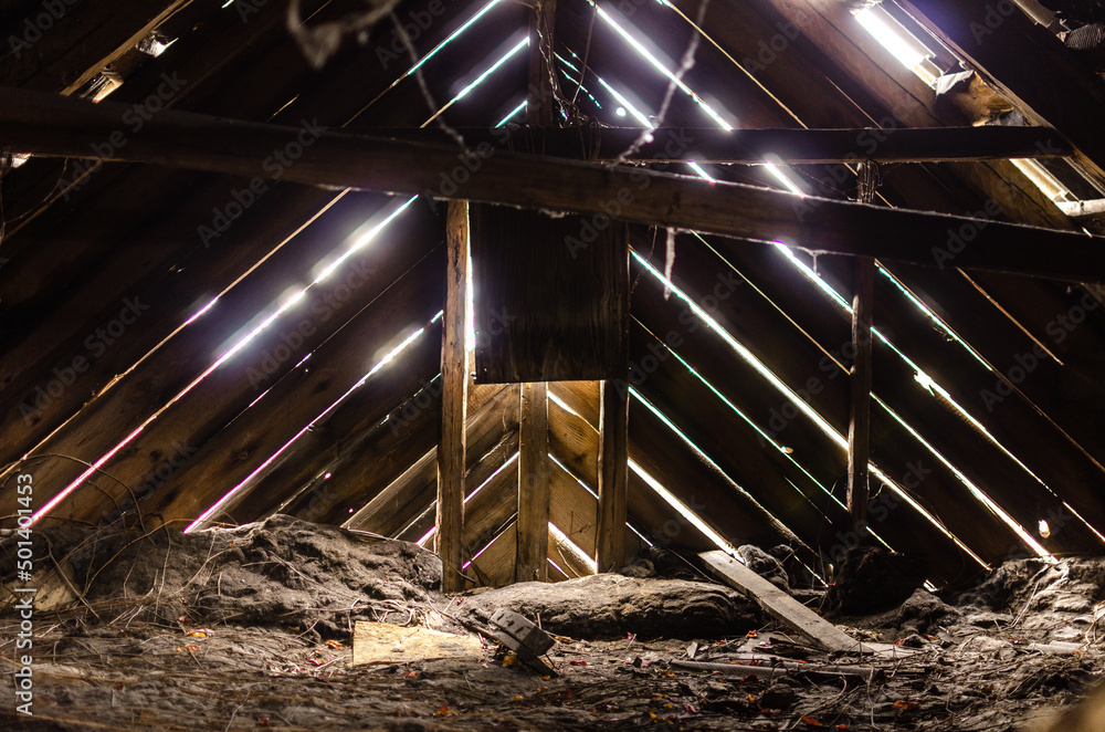 abandoned attic of an abandoned house, you can see wooden ceilings ...