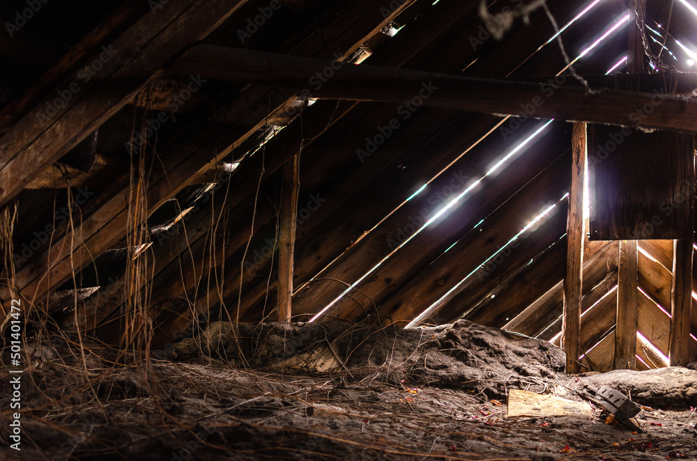 abandoned attic of an abandoned house, you can see wooden ceilings ...