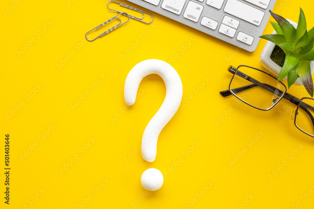 Question mark signs on office table. Customer support servise or FAQ ...