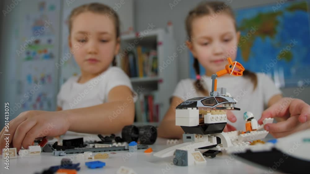 Video Stock Two little preschooler sisters playing with colorful ...