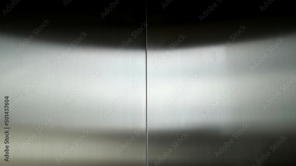 ,Inside passenger elevator,Reflection of light on a shiny metal texture ...