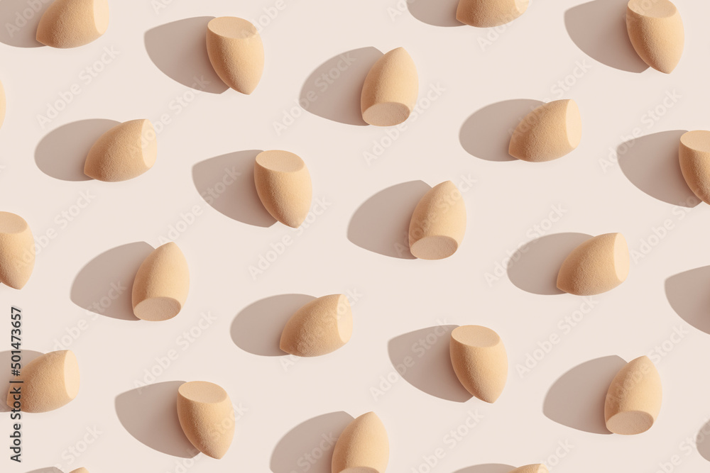 Minimal pattern from makeup sponges for foundation cream on beige color ...