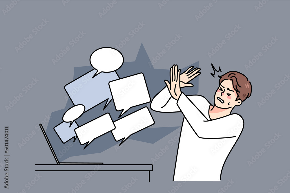 Stressed man overwhelmed with online negative comments and messages on ...