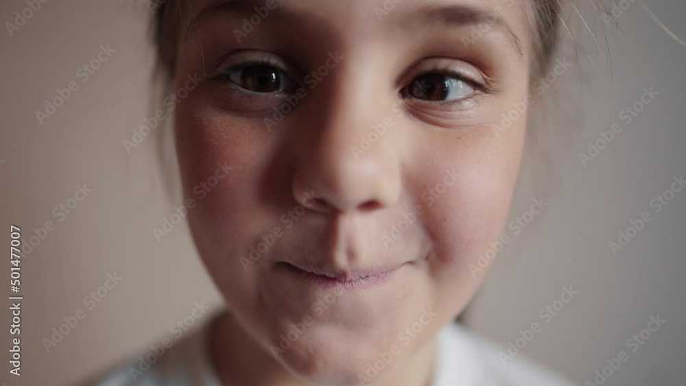 Video Stock child girl playing funny a squinting eyes. strabismus ...