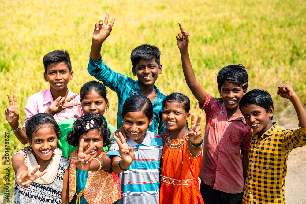 Group of village teenage kids standing with smiling by looking at ...
