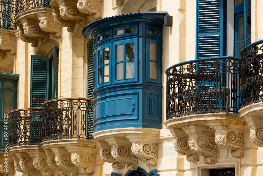 Building with blue painted wooden balconies Stock Photo | Adobe Stock