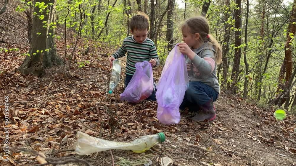 Lovely preschool girl smiling, showing full plastic bag with trash ...