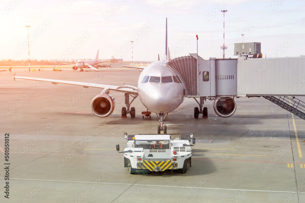 Departure of the airplane from the air bridge, towing and launch jet ...