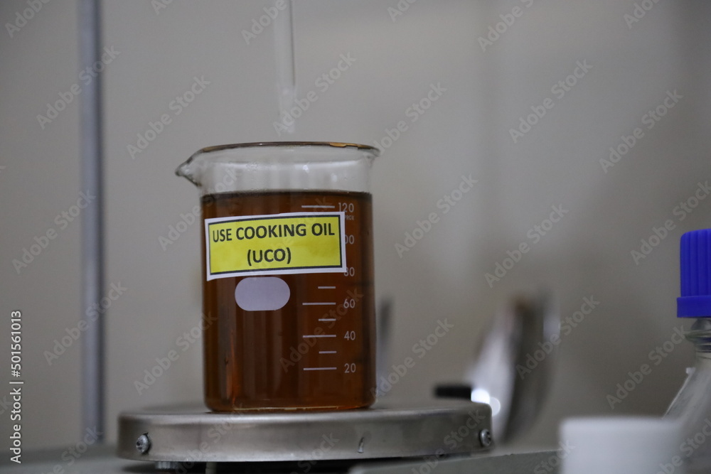 used cooking oil in glass cups for biodiesel feedstock. used cooking ...