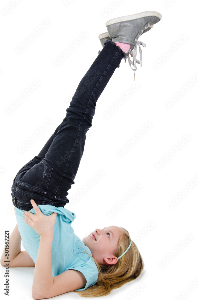 Girl child practicing yoga, stretching, doing shoulderstand exercise ...