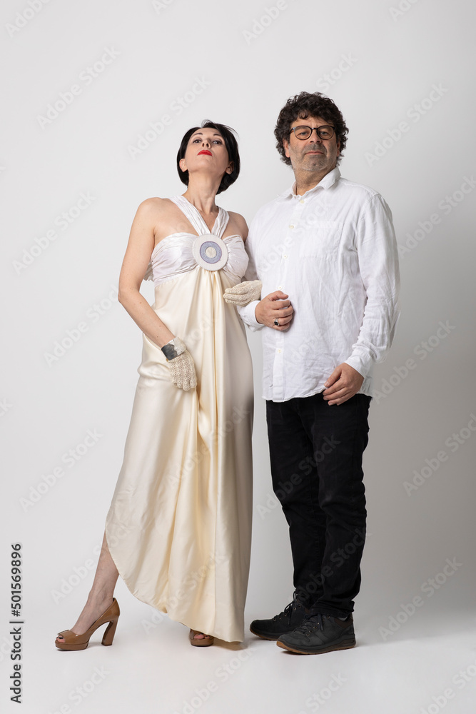 50-year-old couple poses in front of the photographer in a haughty ...