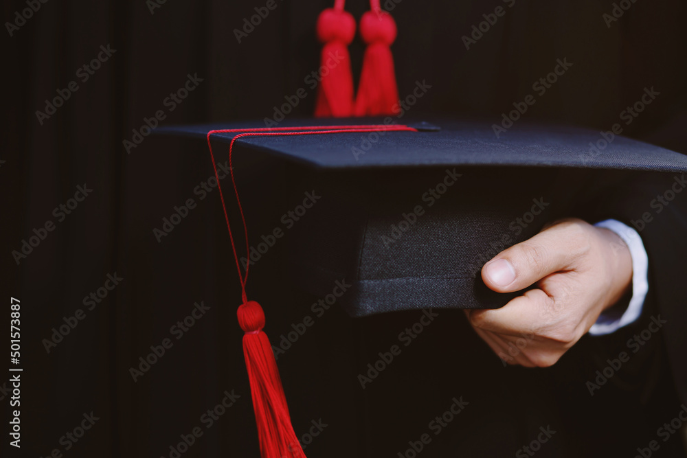graduation,Student hold hats in hand during commencement success ...